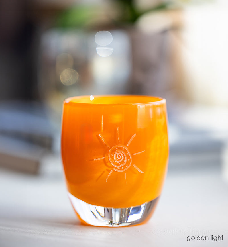 golden light | B+ Heroes etched design on orange hand-blown glass ...
